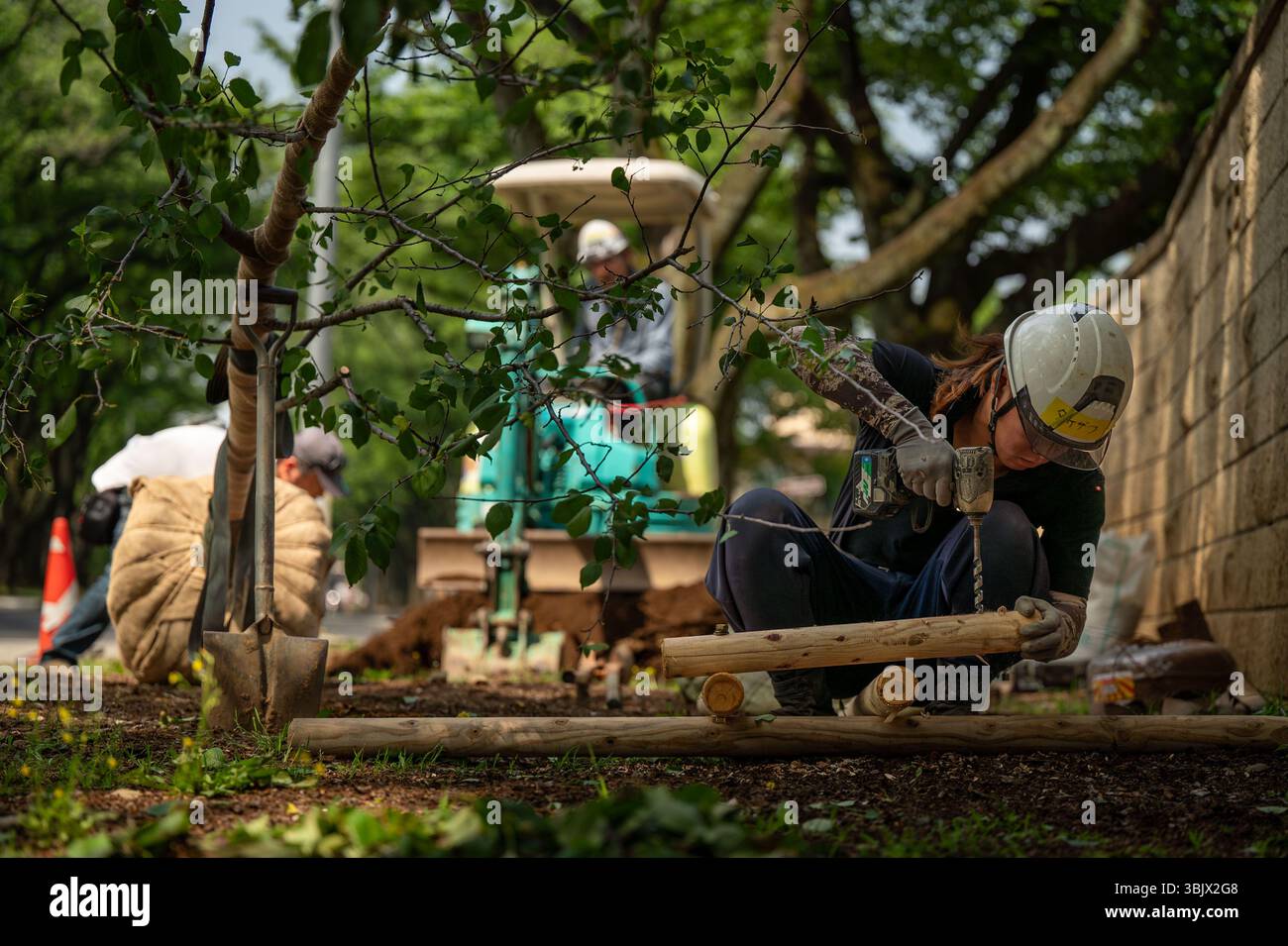 Contractors with the 374th Civil Engineer Squadron prepare a site for ...