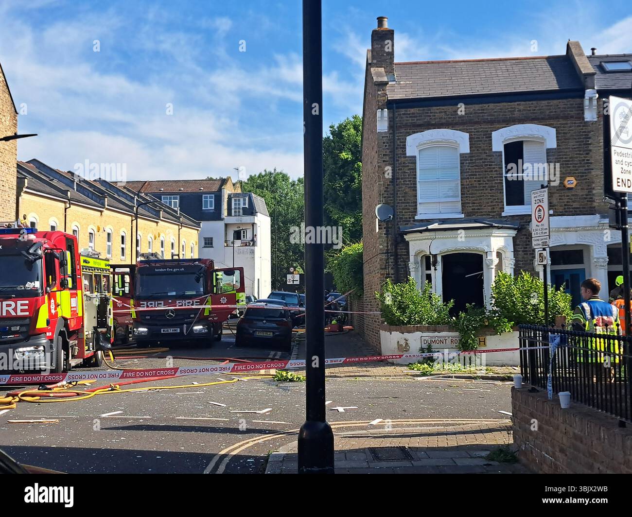 Emergency services near to the scene of a suspected gas explosion which ...