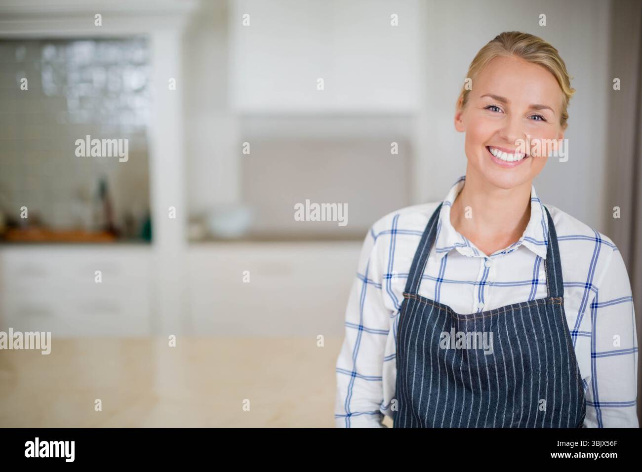 Wooden counter running through home kitchen with subway-tile backsplash ...