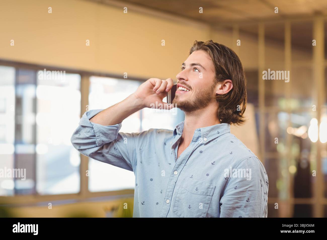 Smartphone displaying ongoing call and glowing screen inside modern ...
