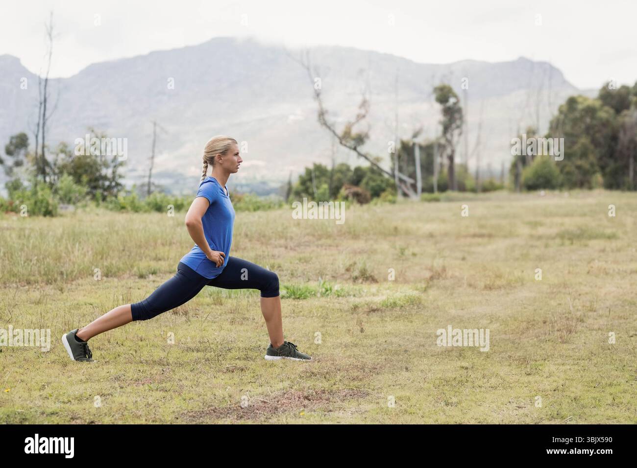 Woman performing forward lunge hi-res stock photography and images - Alamy