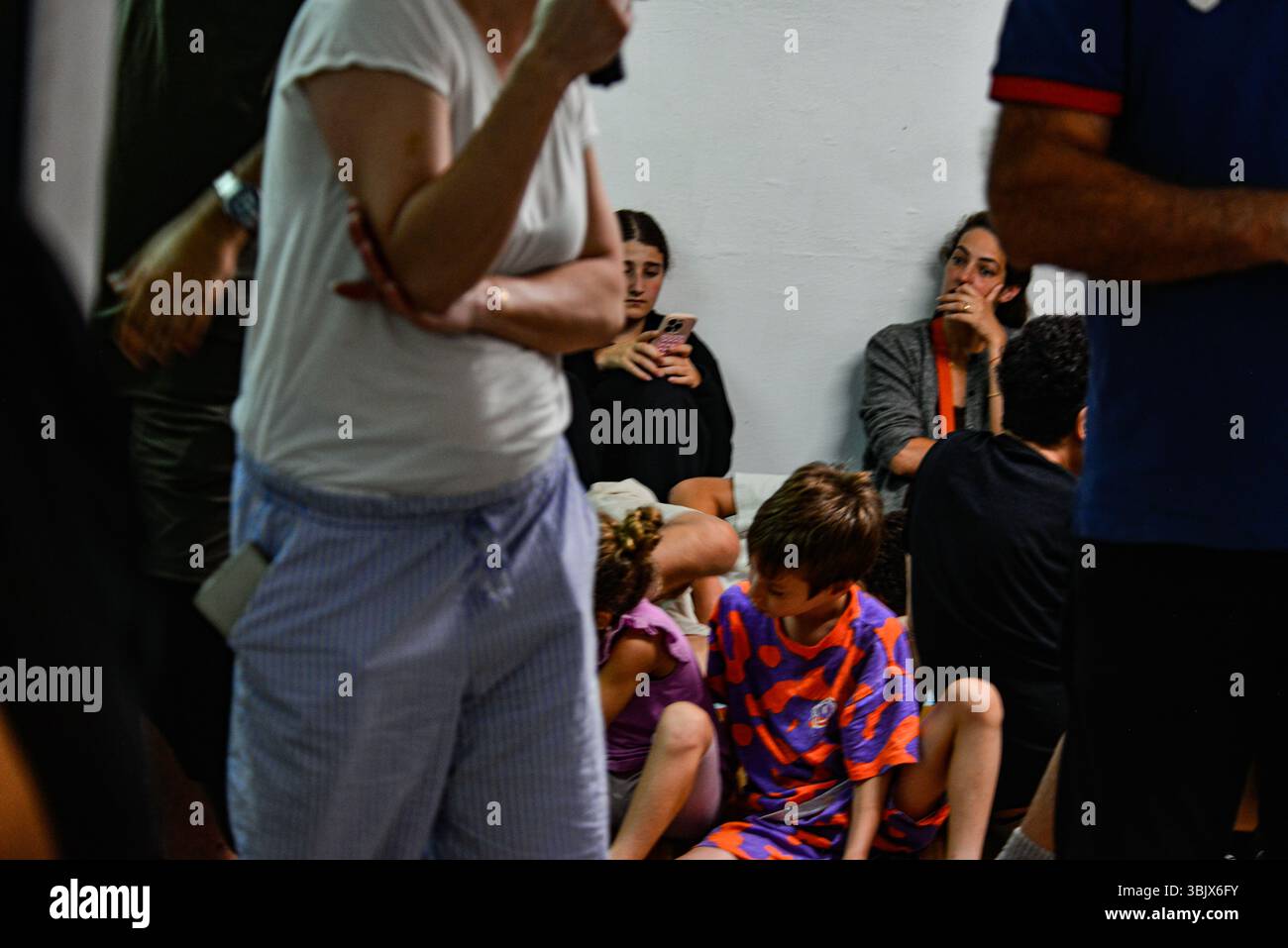 Israel. 17th June, 2025. Israeli families in a public shelter during an ...
