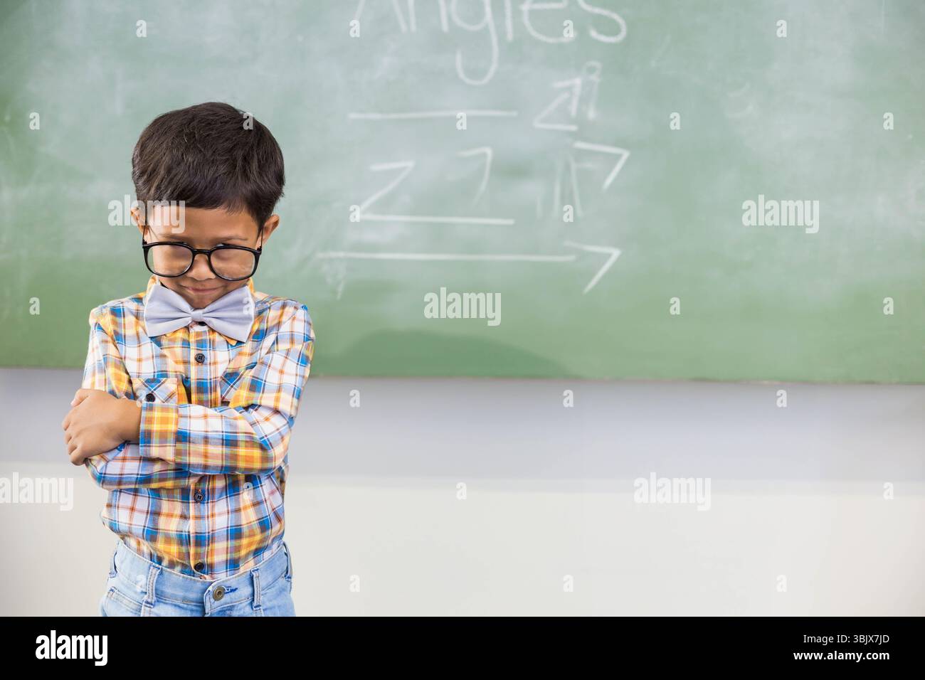 Green chalkboard displaying cursive Angles heading in classroom, with ...