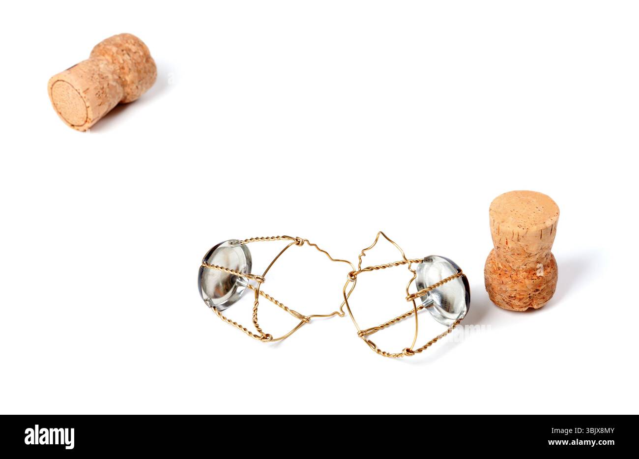 Two corks from champagne wine and muselets Stock Photo - Alamy