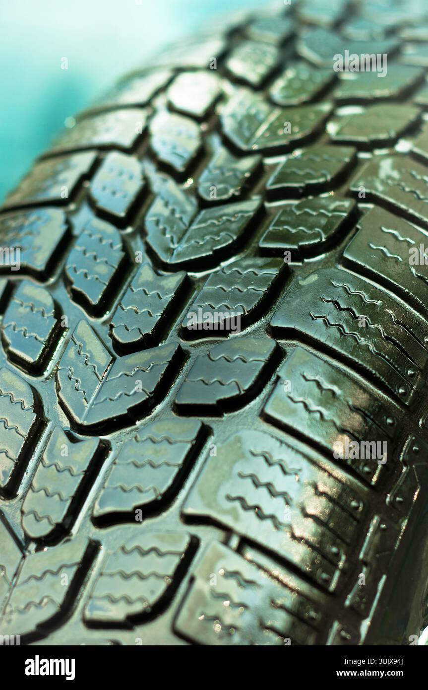 Wet car tire texture in green and blue colors Stock Photo - Alamy