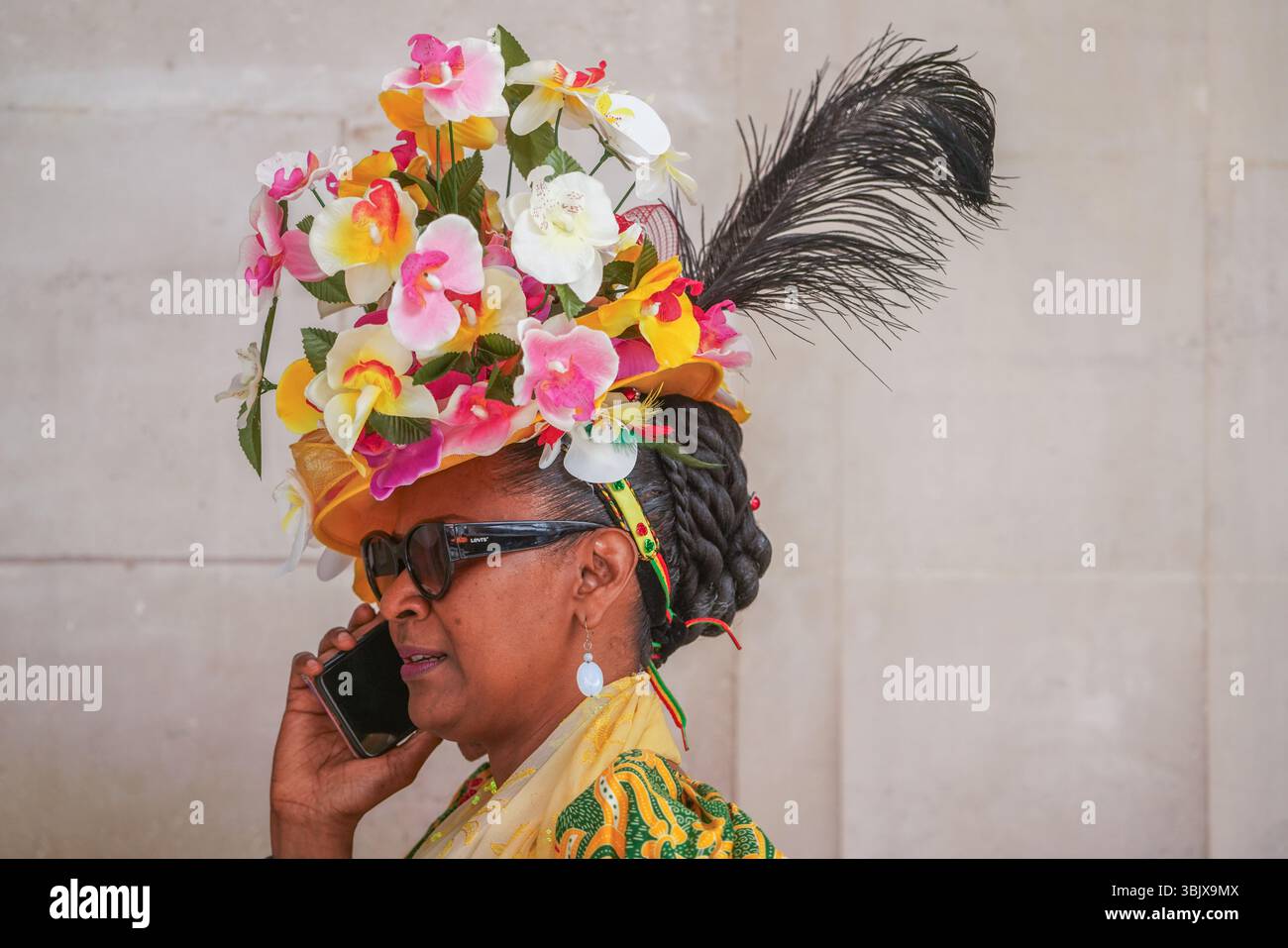 London, UK. 17 June 2025. A racegoer with colourful millinery at ...