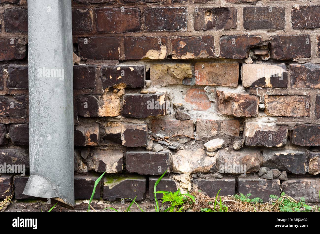 Brick wall with pipe Stock Photo - Alamy