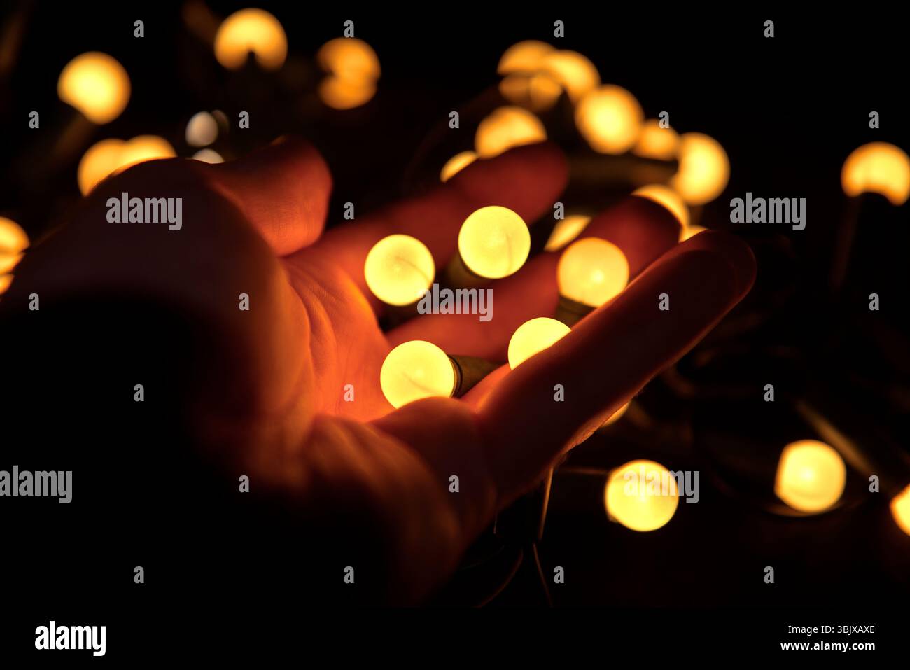 Bright yellow balls closeup photo in dark hi-res stock photography and ...