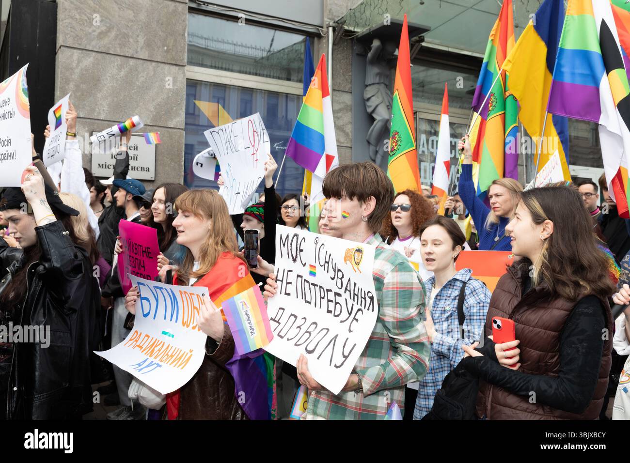 June 14, 2025, Kyiv, Ukraine: People march during a pride parade ...