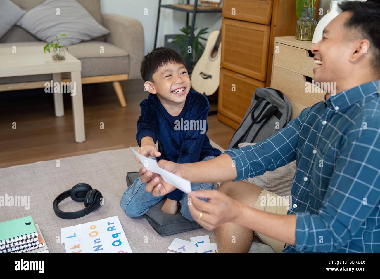 Father and Son Sharing Laughter. Engaging in playful learning ...