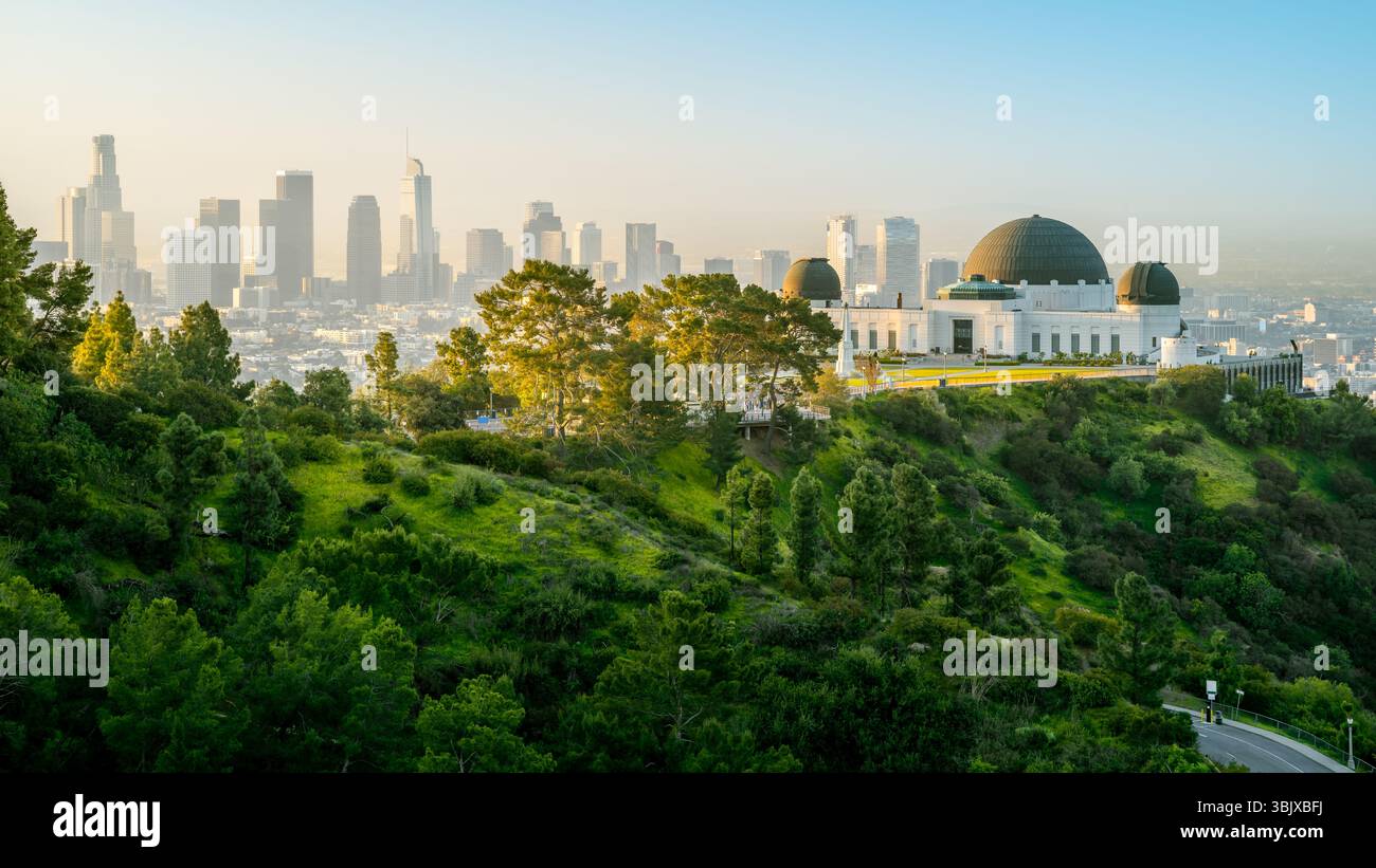 the famous griffith observatory and los angeles skyline during sunrise ...