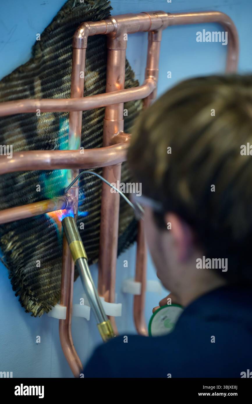 plumber soldering copper pipes Stock Photo - Alamy