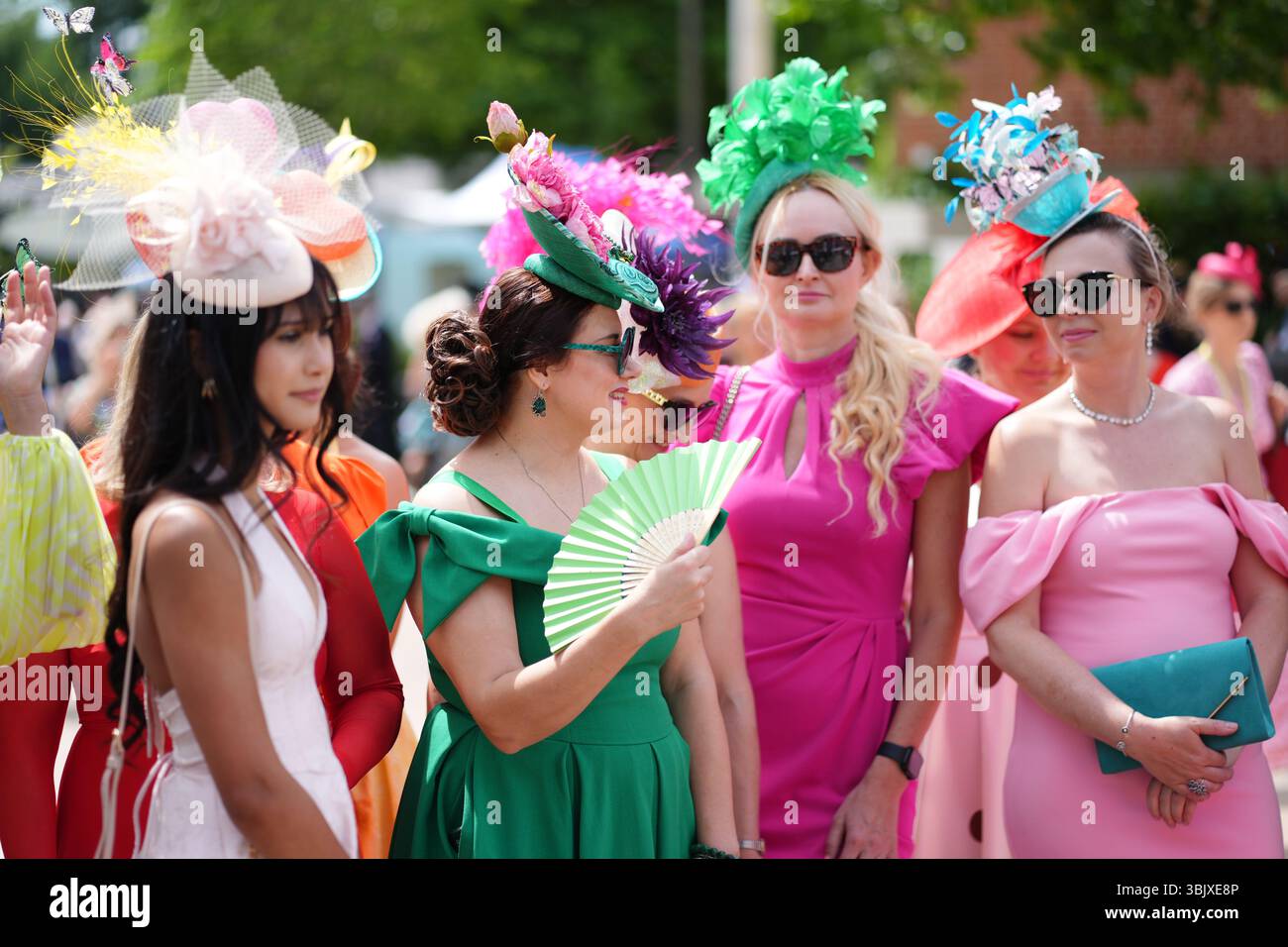 Racegoers with brightly coloured dresses and hats during day one of ...