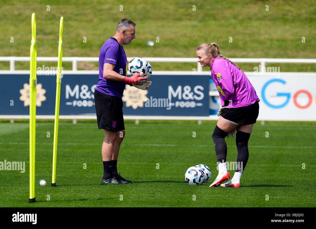 England's Hannah Hampton with coach Darren Ward during a training ...
