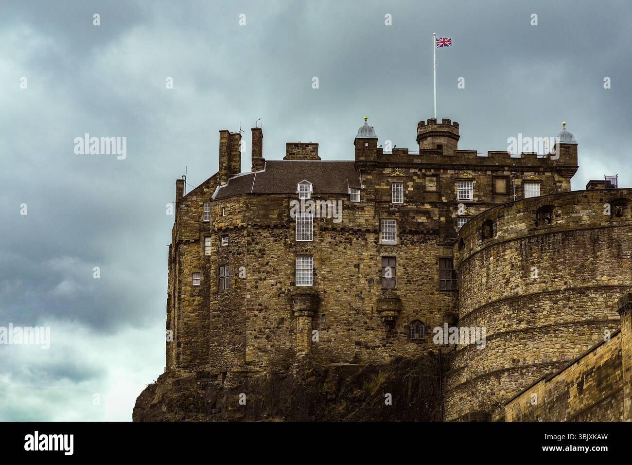 View of the iconic Edinburgh Castle with Union Jack flag flying against ...