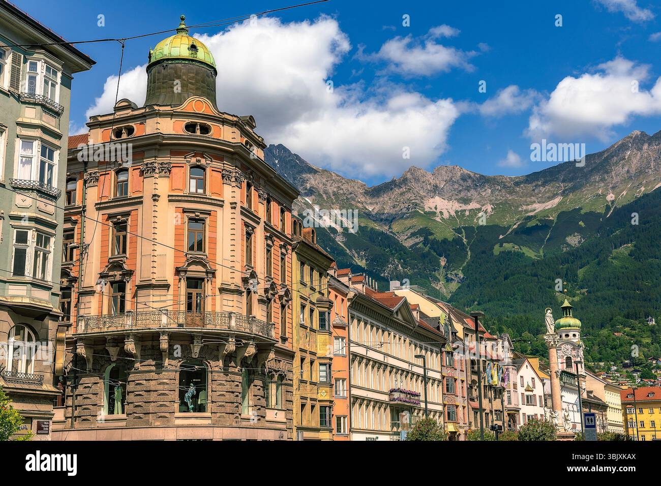 Colorful historic buildings of Innsbruck, Austria, with the majestic ...