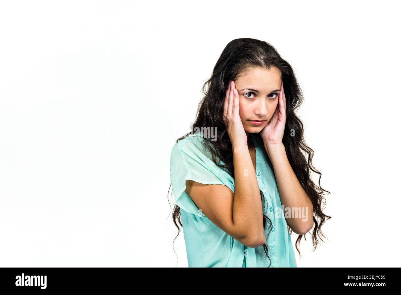 Adult woman standing on white background wearing mint green blouse and ...