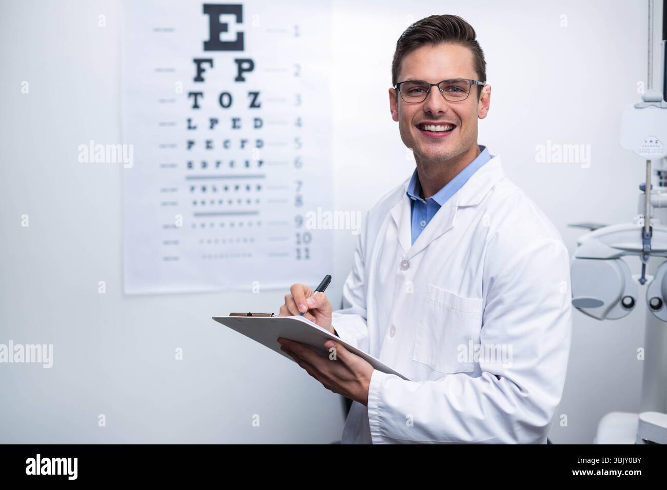 Optometry workstation featuring phoropter and Snellen chart in bright ...