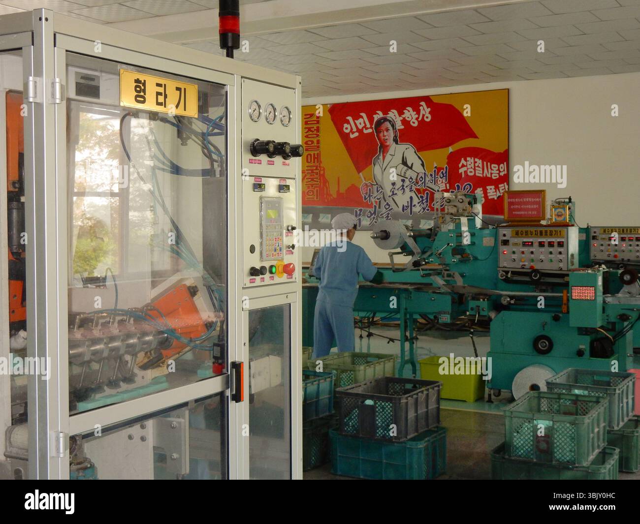 A Worker Inside a North Korean Factory in Sinuiju, Complete with ...