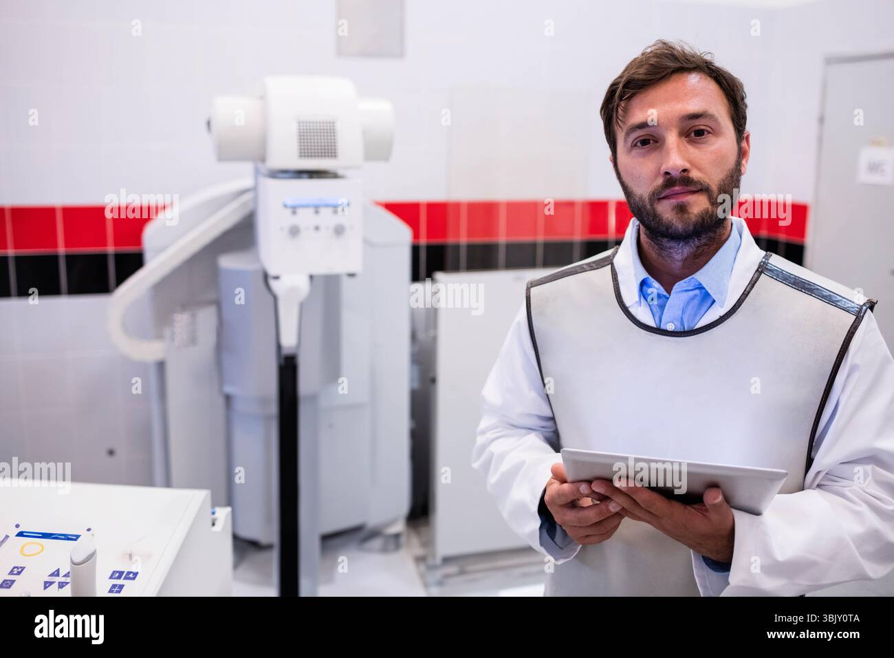 Medical technician wearing lead apron hi-res stock photography and ...
