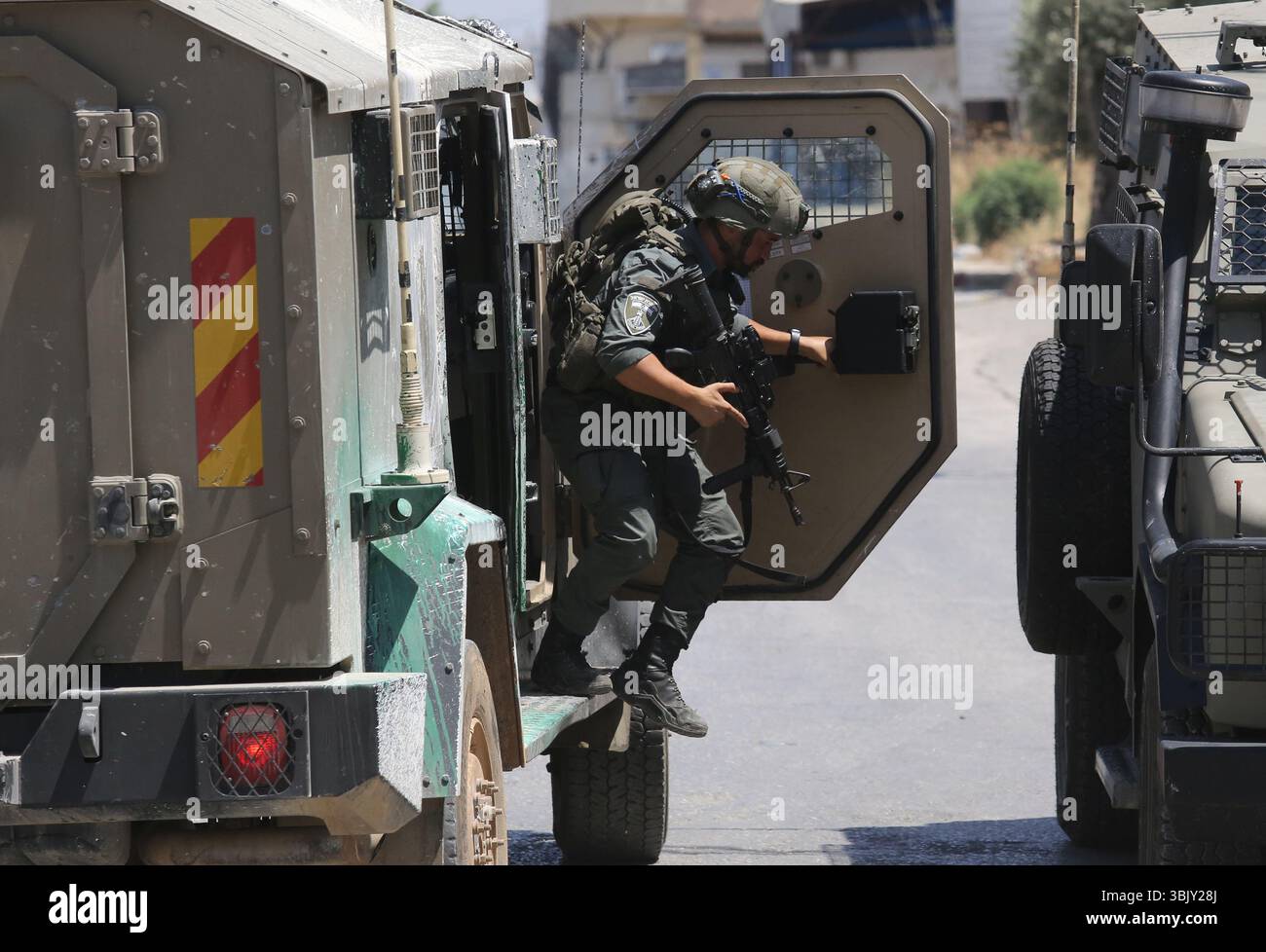 Nablus, West Bank. 16th June, 2025. A member of Israeli forces is seen ...