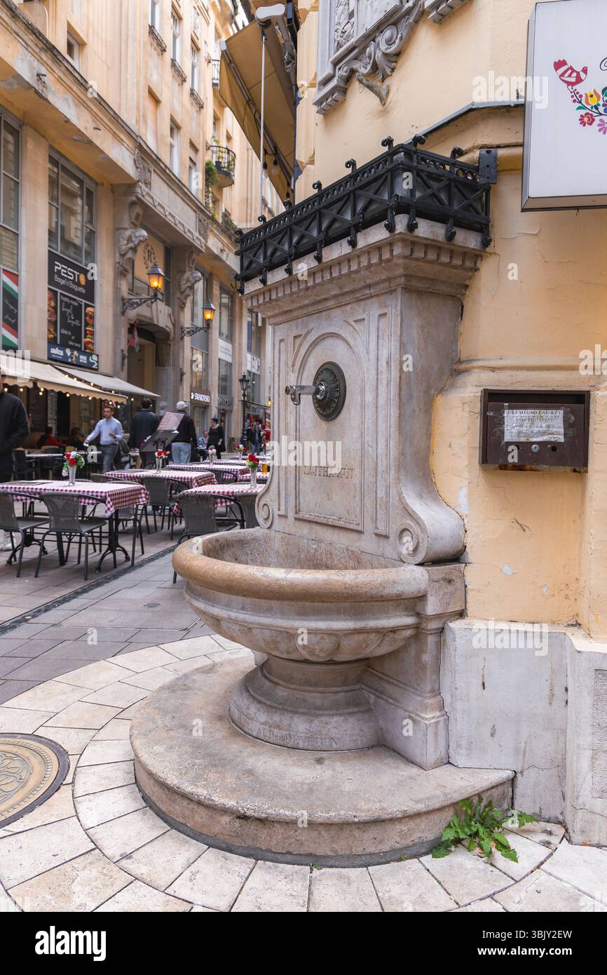 Historic Stone Fountain with Inscription in European Street Scene Stock ...