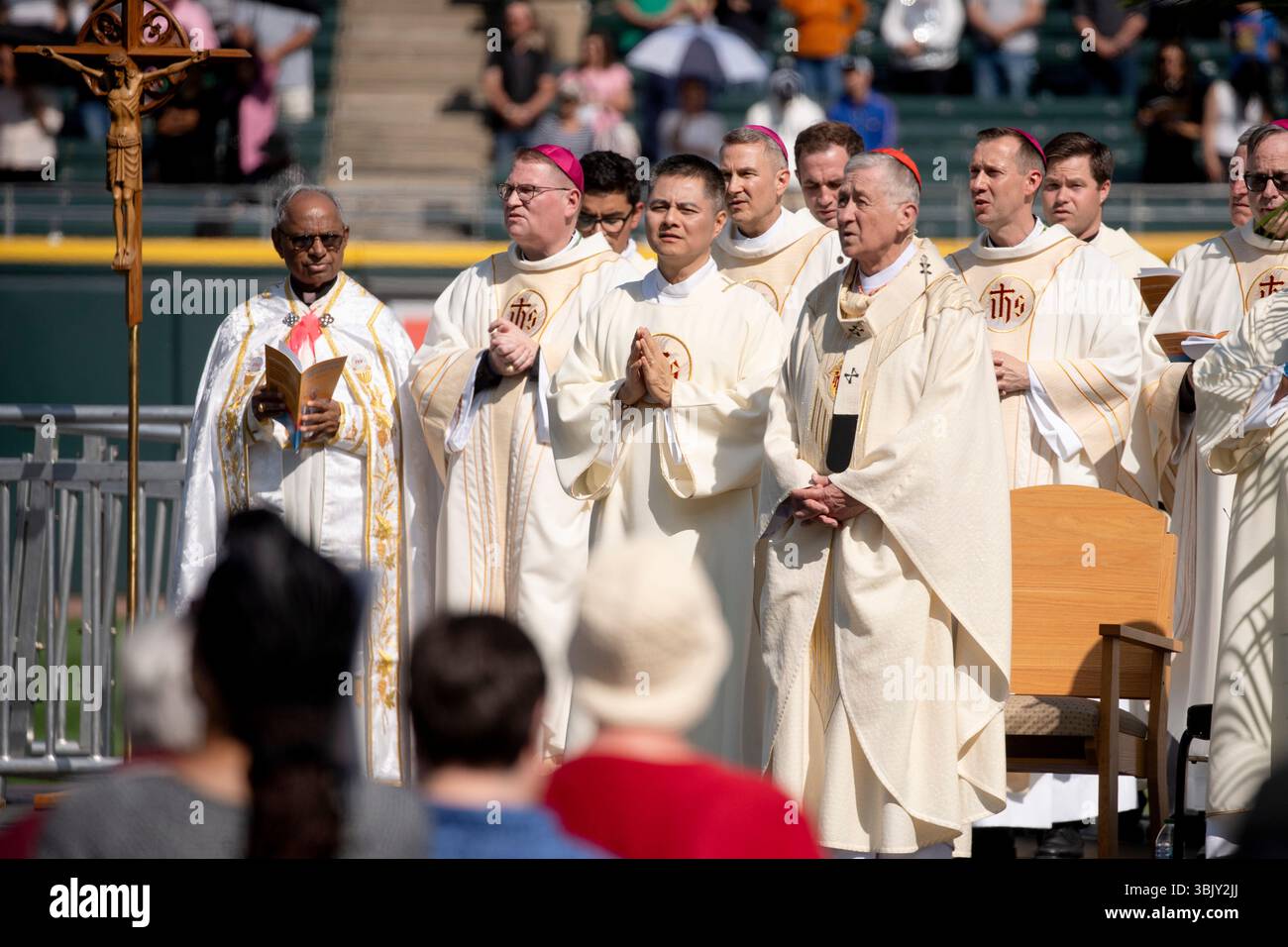 Cardinal Blase Cupich (right) presides over a mass during the ...