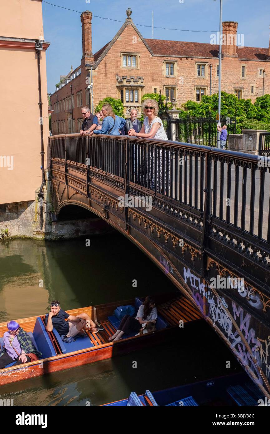Cambridge UK June 2025 - Female tourist on the Magdalene Street bridge ...