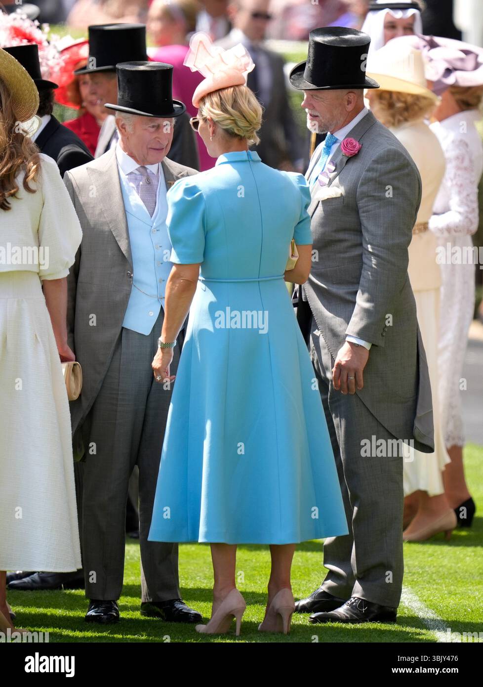 King Charles III speaks with Zara Tindall and Mike Tindall ahead of the ...