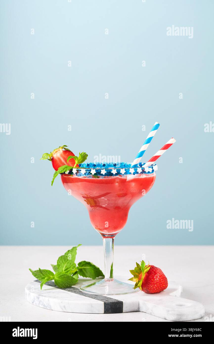Patriotic Cocktail 4th july. Glass margarita cocktail with strawberry ...
