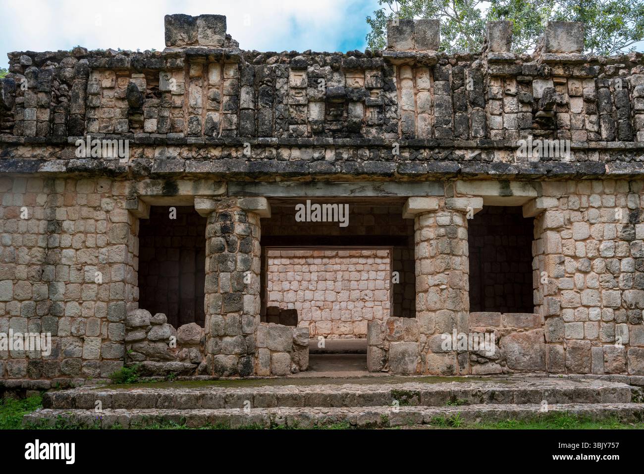 Old Mayan typical house stone structure with doorways and ancient ...