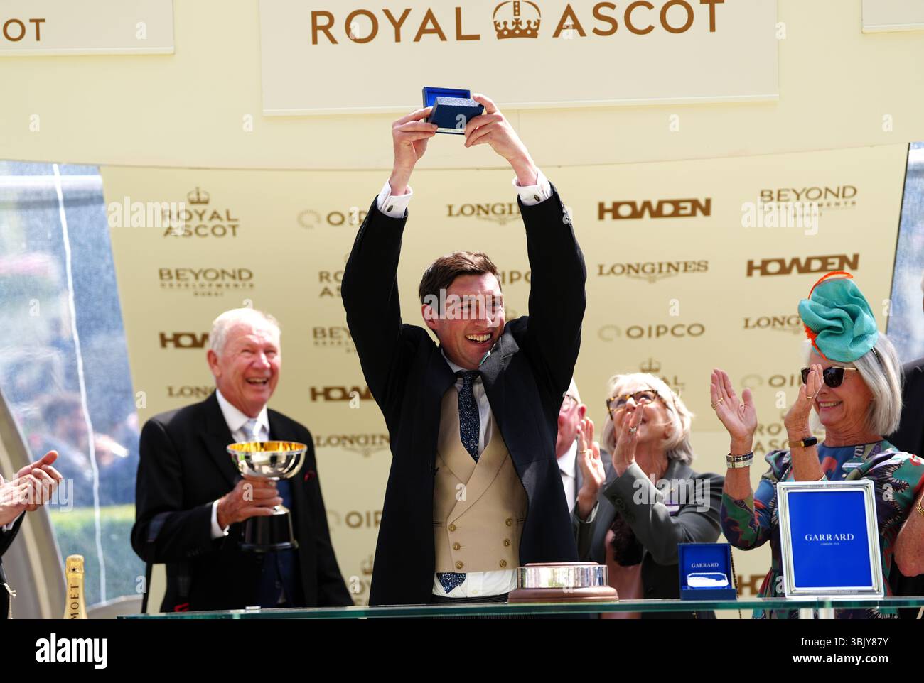 Trainer Harry Eustace celebrates after winning the Queen Anne Stakes ...
