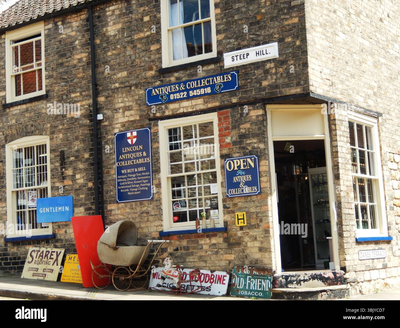 Antique Shopfront Displaying Collectibles in a Quaint Historical ...