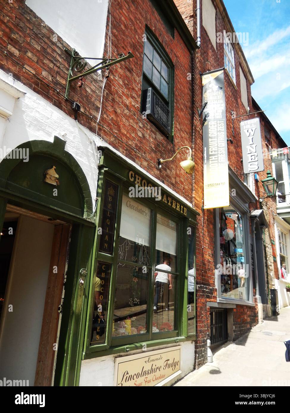 Historic European Storefronts Featuring Chocolate Shop Along a ...
