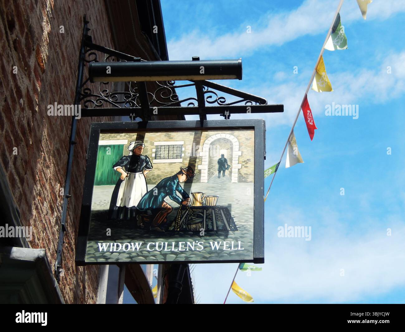 Historic Hanging Sign for Widow Cullen's Well in Sunlit Setting ...