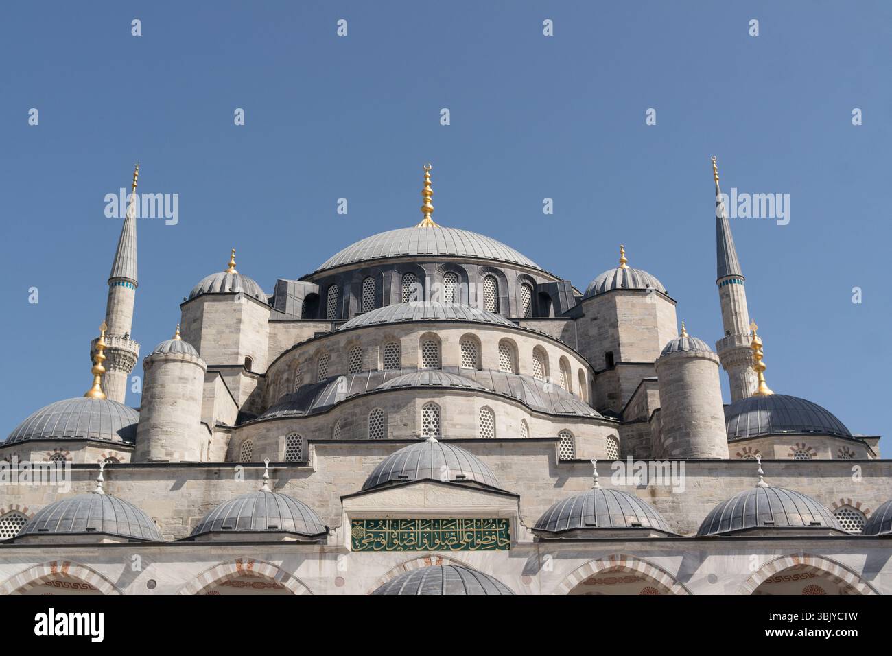 Visitors admire the stunning architecture of the Blue Mosque in ...