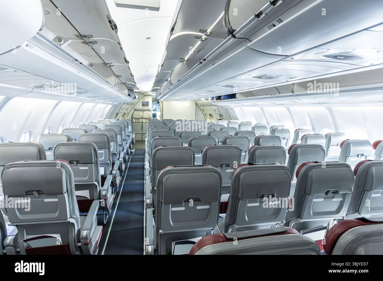 Inside empty wide body passenger plane cabin Stock Photo - Alamy