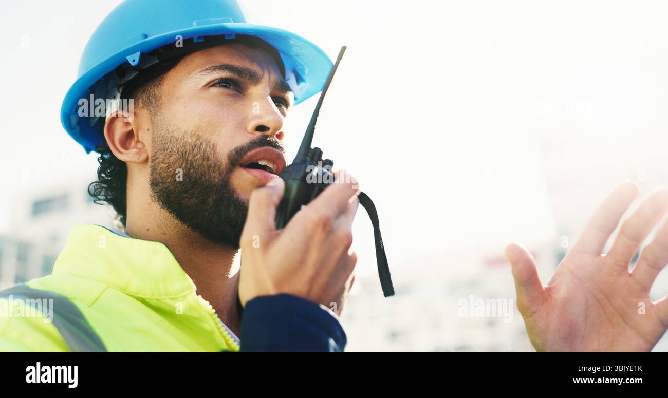 Construction site, radio and man with engineering, conversation and ...