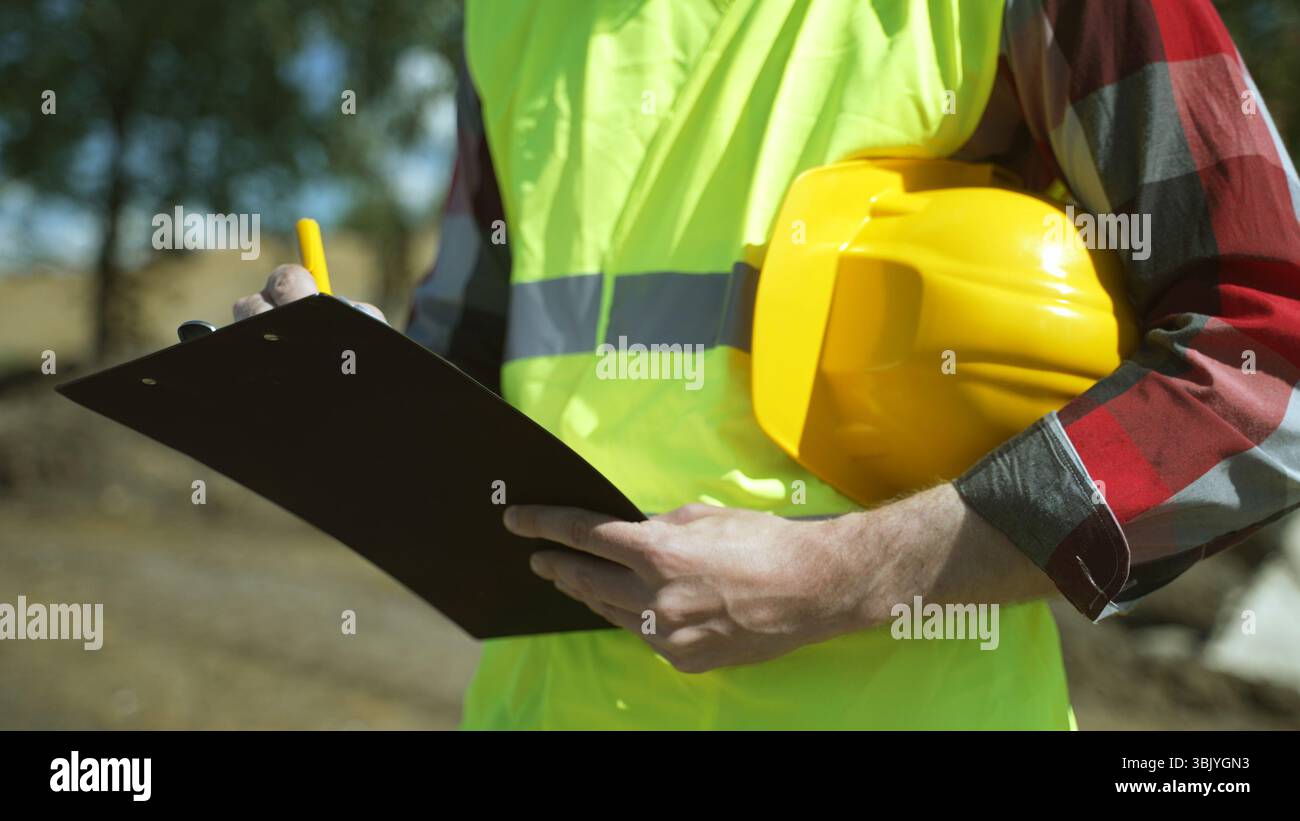 Builder hard hat inspects construction hi-res stock photography and ...