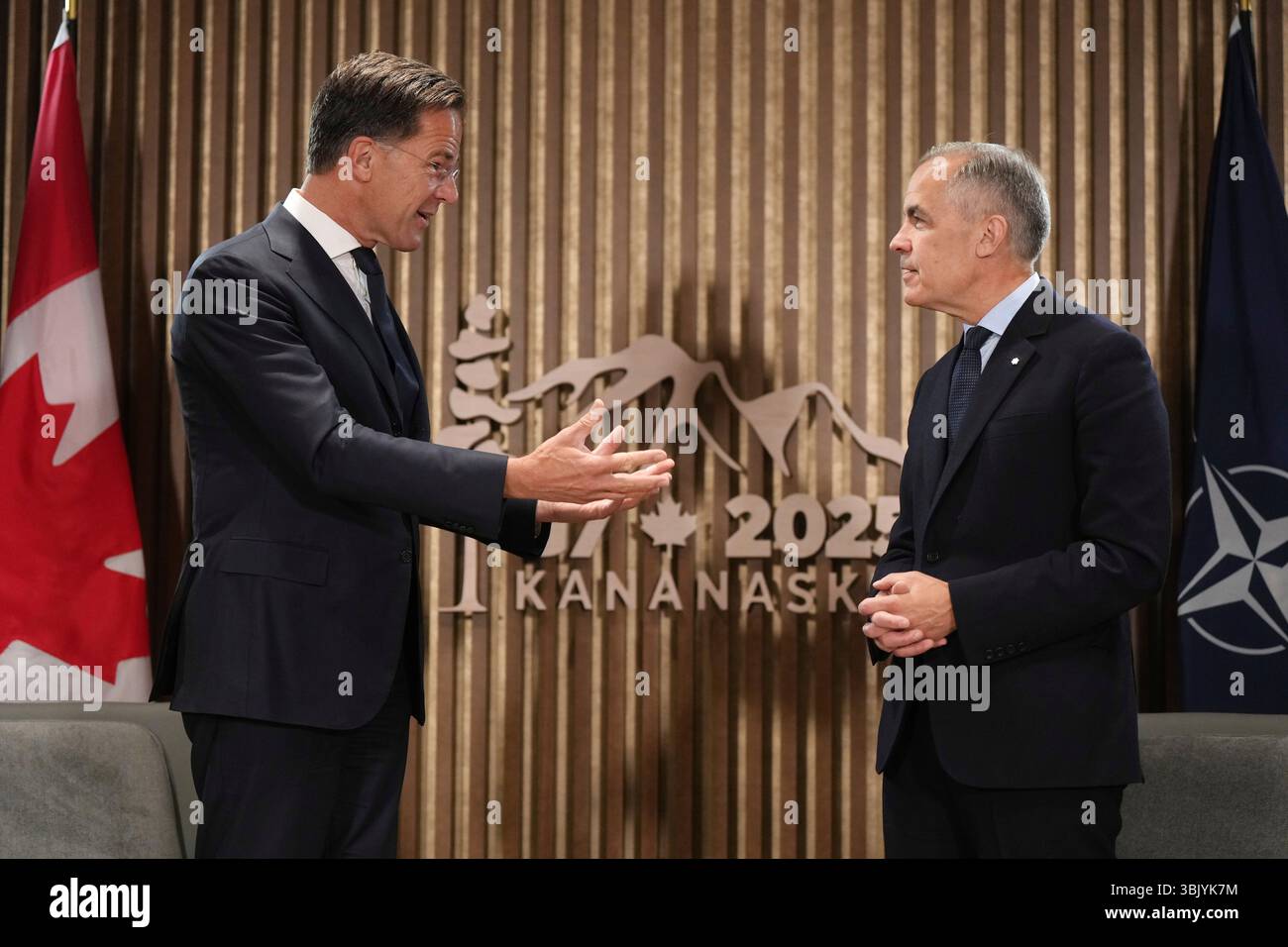 Canadian Prime Minister Mark Carney, right, and NATO secretary-general ...