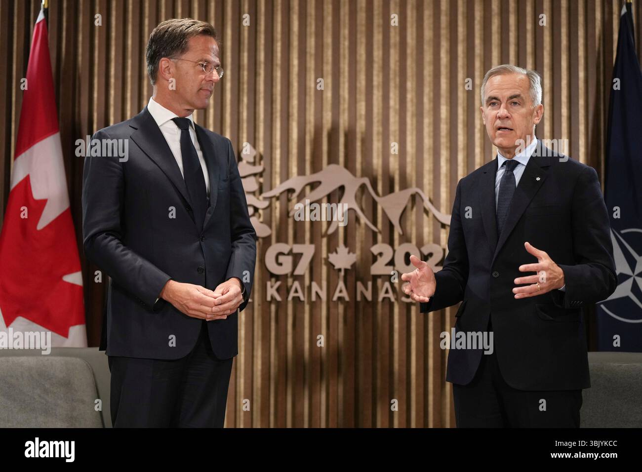 Canadian Prime Minister Mark Carney, right, and NATO secretary-general ...