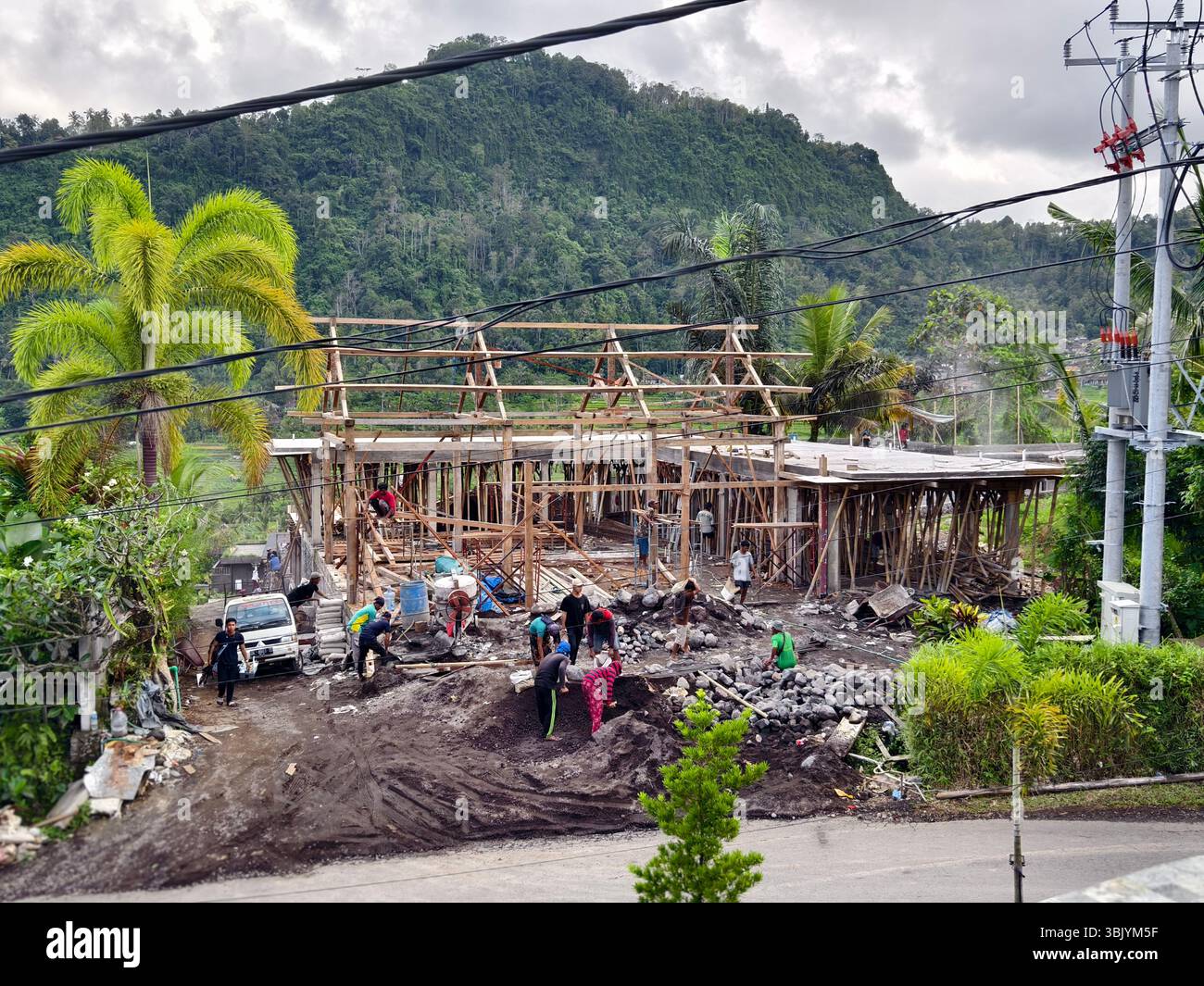 Sidemen, Bali, Indonesia – May 10, 2025: A group of local construction ...