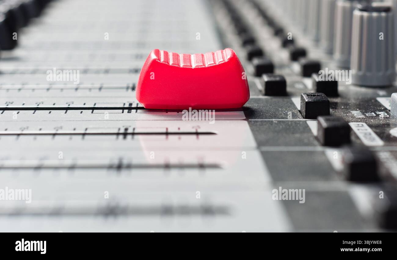 Part of an audio sound mixer with big red button Stock Photo - Alamy