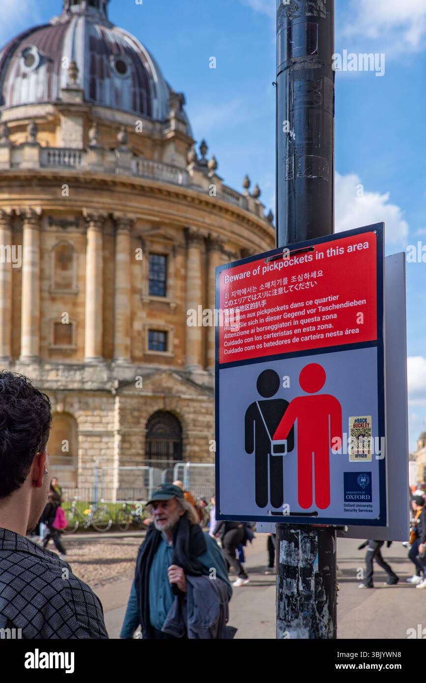 Sign warning of the danger of pickpockets in several languages ...