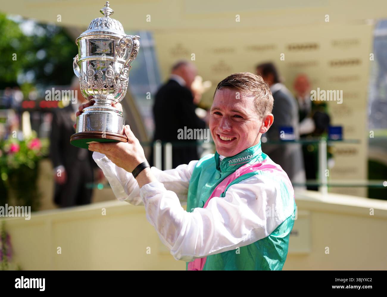Colin Keane lifts the trophy after winning the St James's Palace Stakes ...