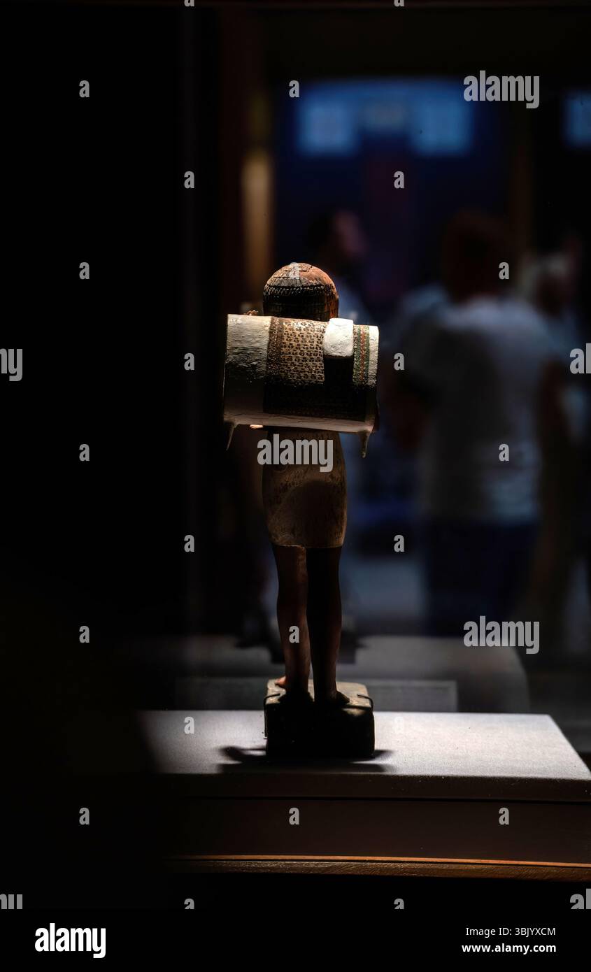 Cairo, Egypt - September 9, 2023: Ancient Egyptian figurine carrying a ...
