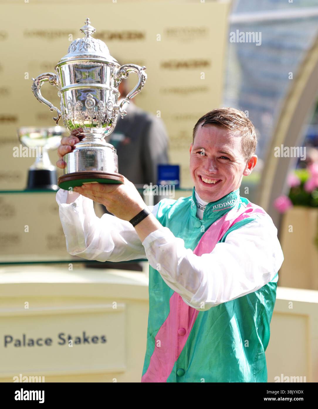 Colin Keane lifts the trophy after winning the St James's Palace Stakes ...