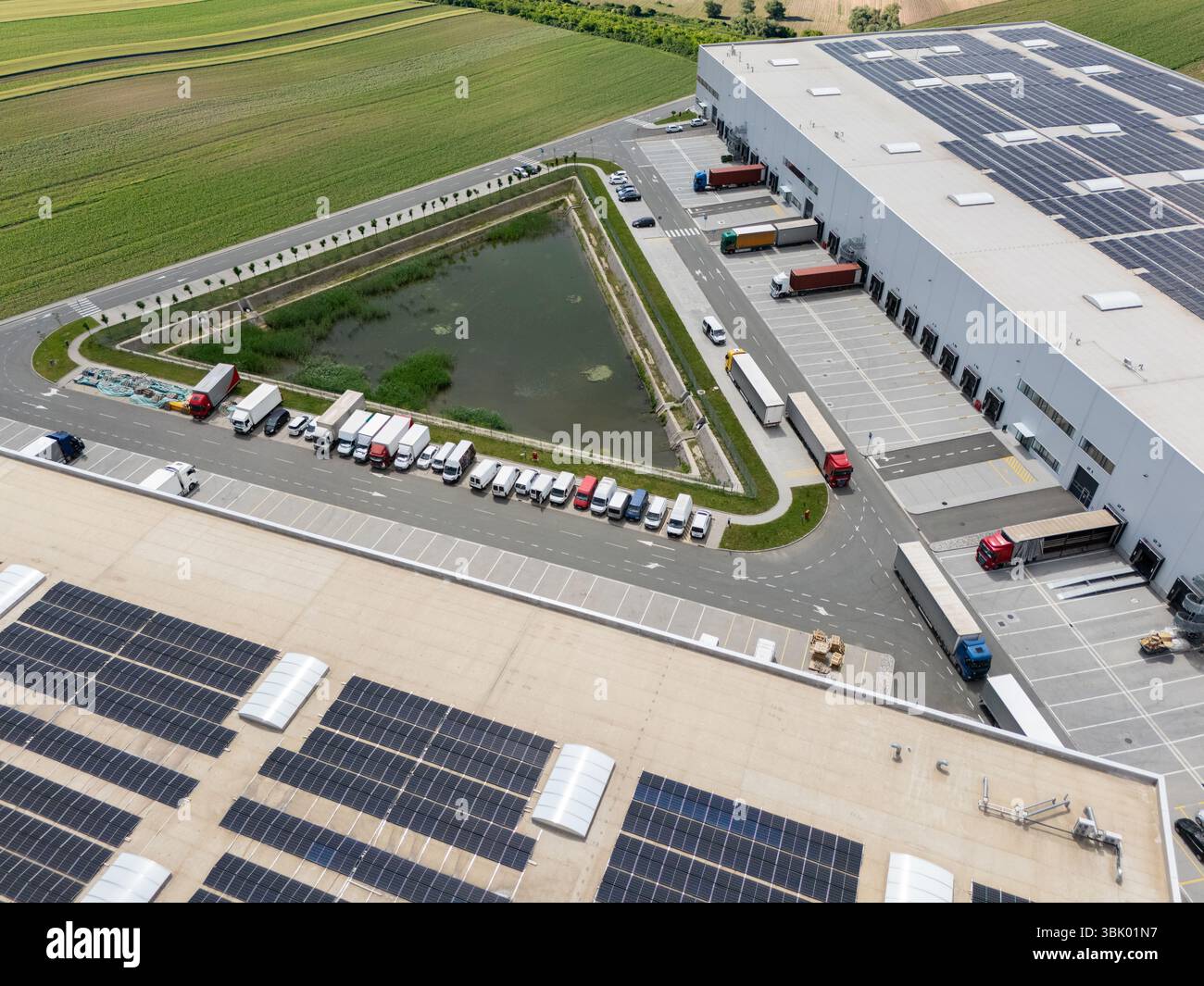 Logistic center with solar panels on roof. Aerial view Stock Photo - Alamy