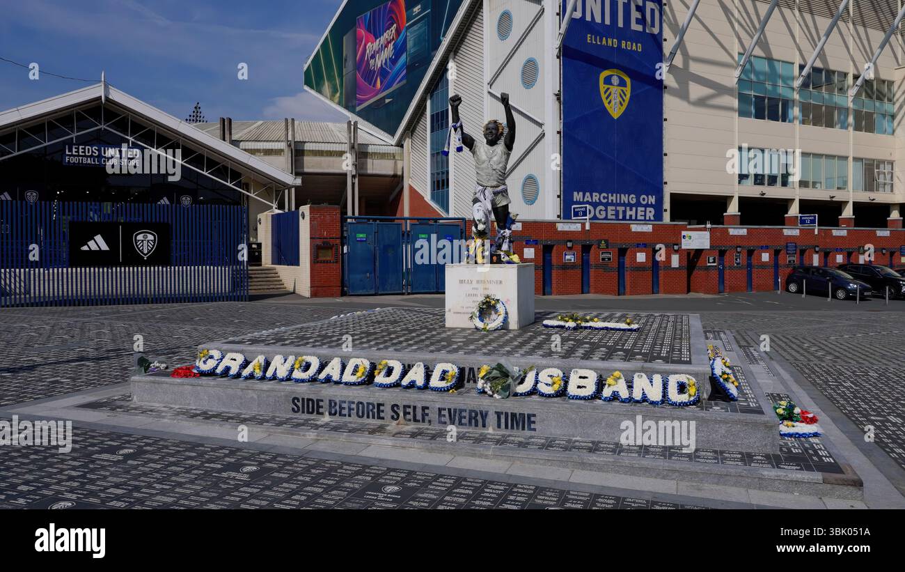 LEEDS, UK - JUNE 12, 2025 - Billy Bremner statue with floral tributes ...