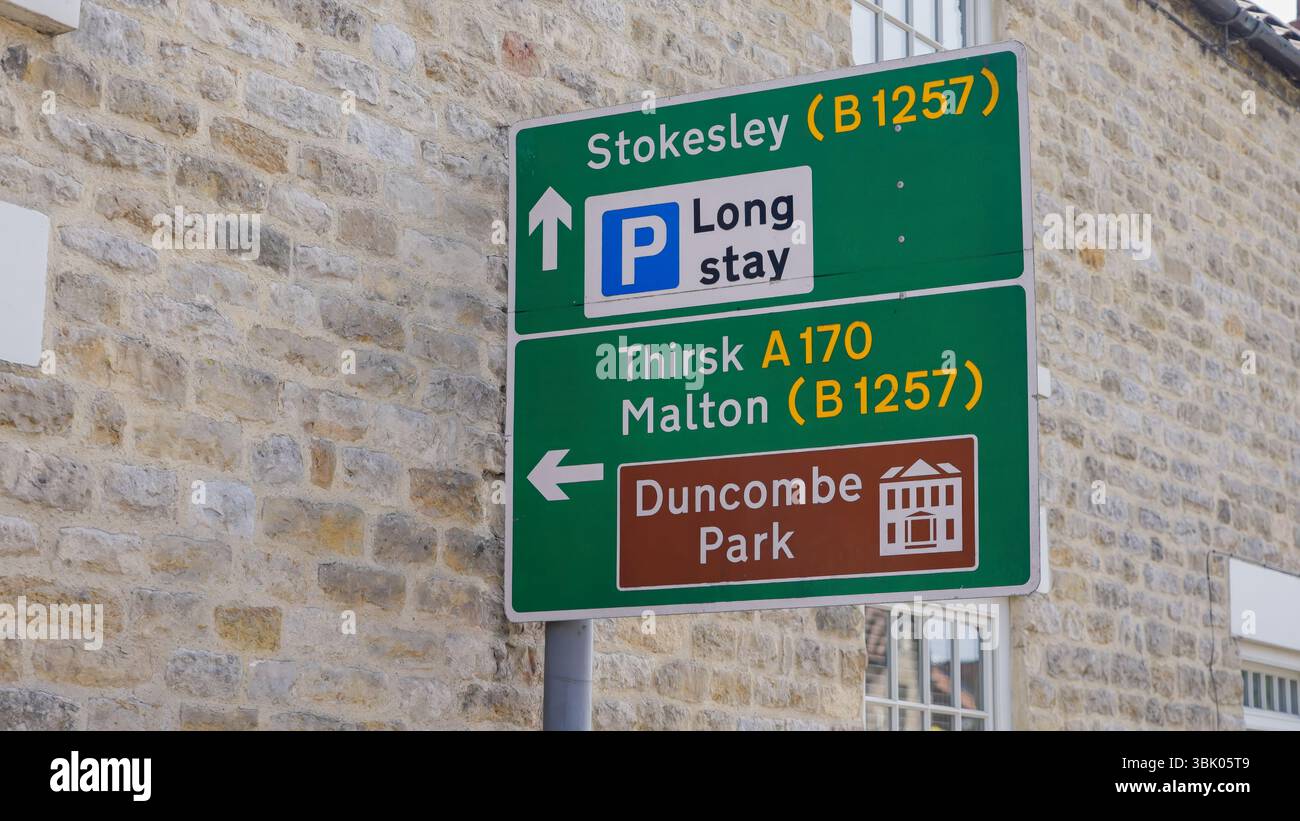 HELMSLEY, UK - JUNE 12, 2025 - Road signs showing directions to ...